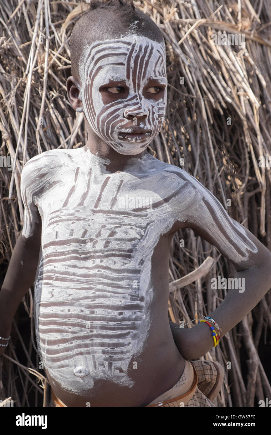 Young boy of the Karo tribe in the Omo Valley of Ethiopia proudly ...