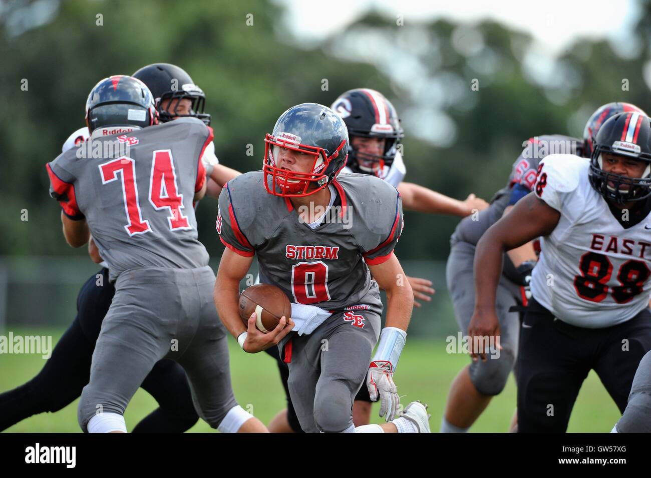 Quarterback taking advantage of blocking by his offensive line to ...