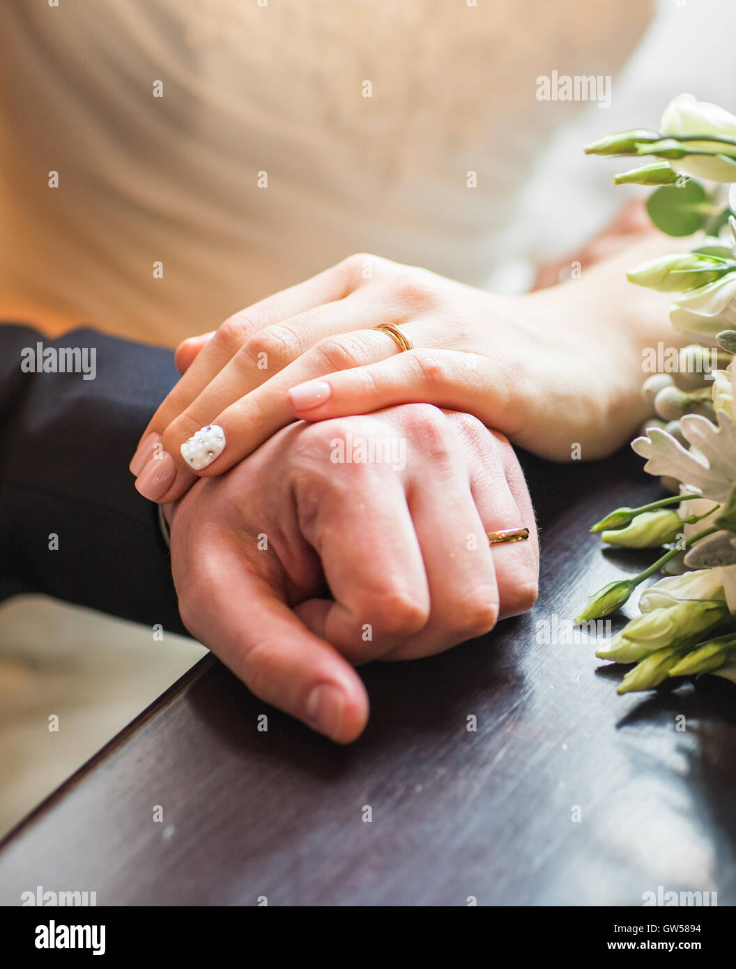 Hands of the bride and groom close-up Stock Photo - Alamy