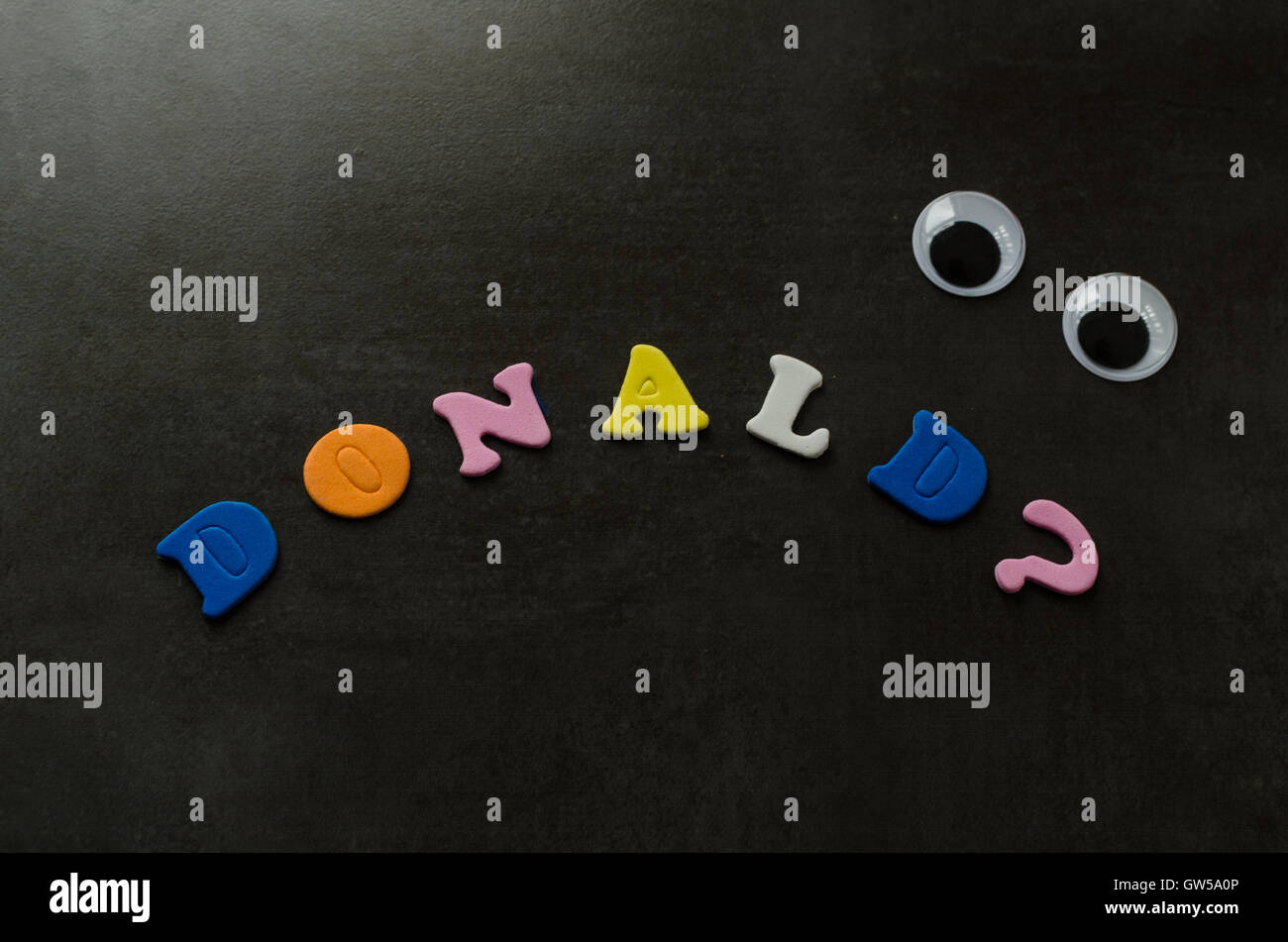 The name Donald spelled out in colorful letters black background with ...