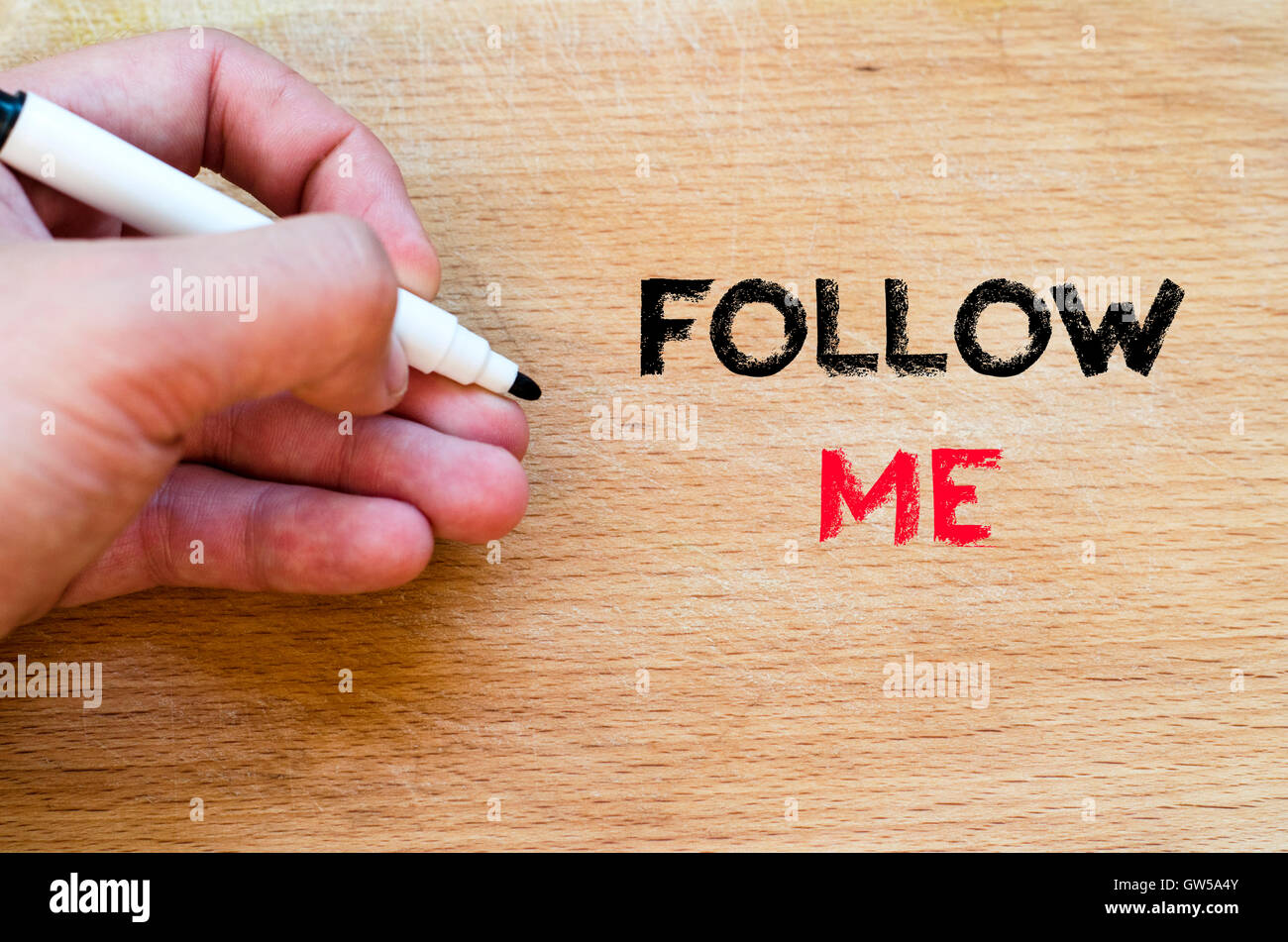 Human hand over wooden background and follow me text concept Stock ...