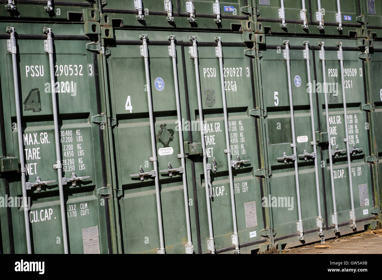 A stack of green shipping containers at a transport yard Stock Photo ...