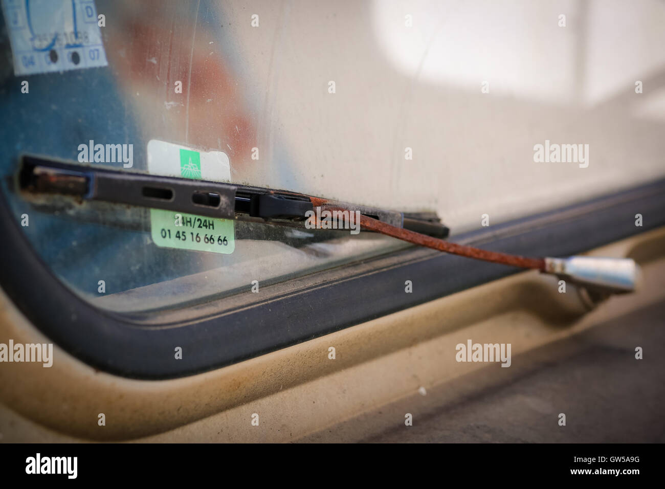 A badly rusted and worn out windscreen wiper Stock Photo - Alamy