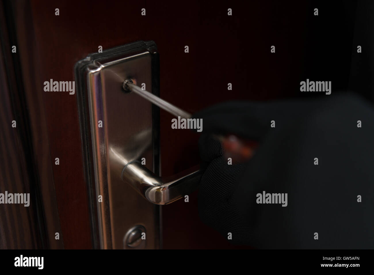 Thief Burglar Force Lock Metal Door With A Tool During House Breaking ...