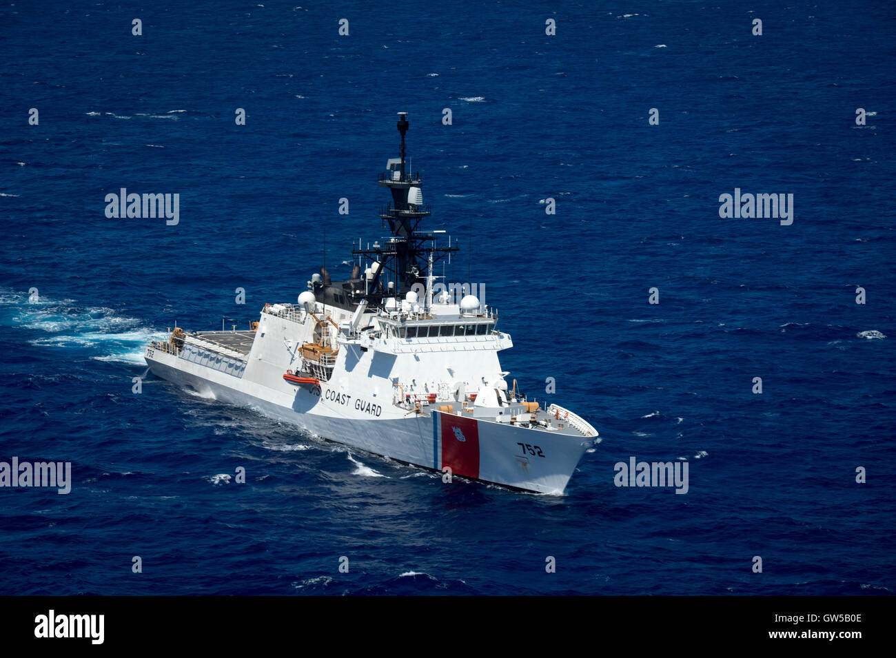 U.S. Coast Guard cutter USCG Stratton steams in close formation during ...