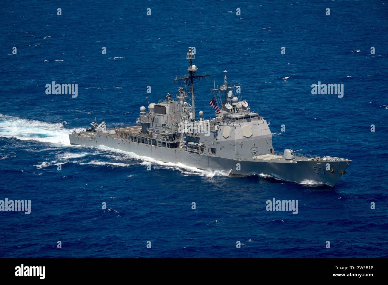 US Navy Guided-missile cruiser USS Mobile Bay steams in close formation ...