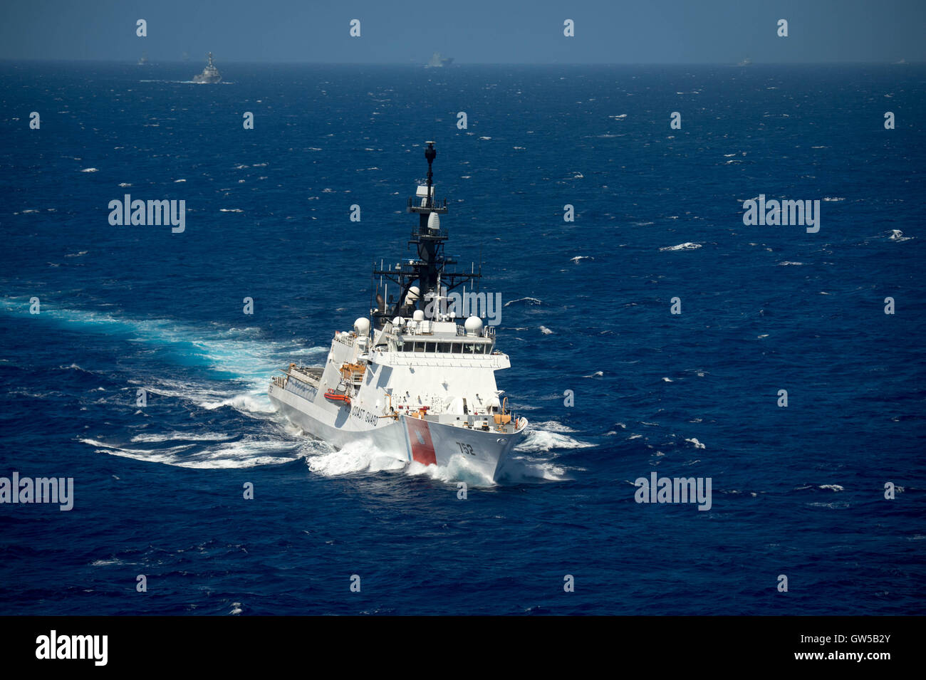U.S. Coast Guard cutter USCG Stratton steams in close formation Stock ...