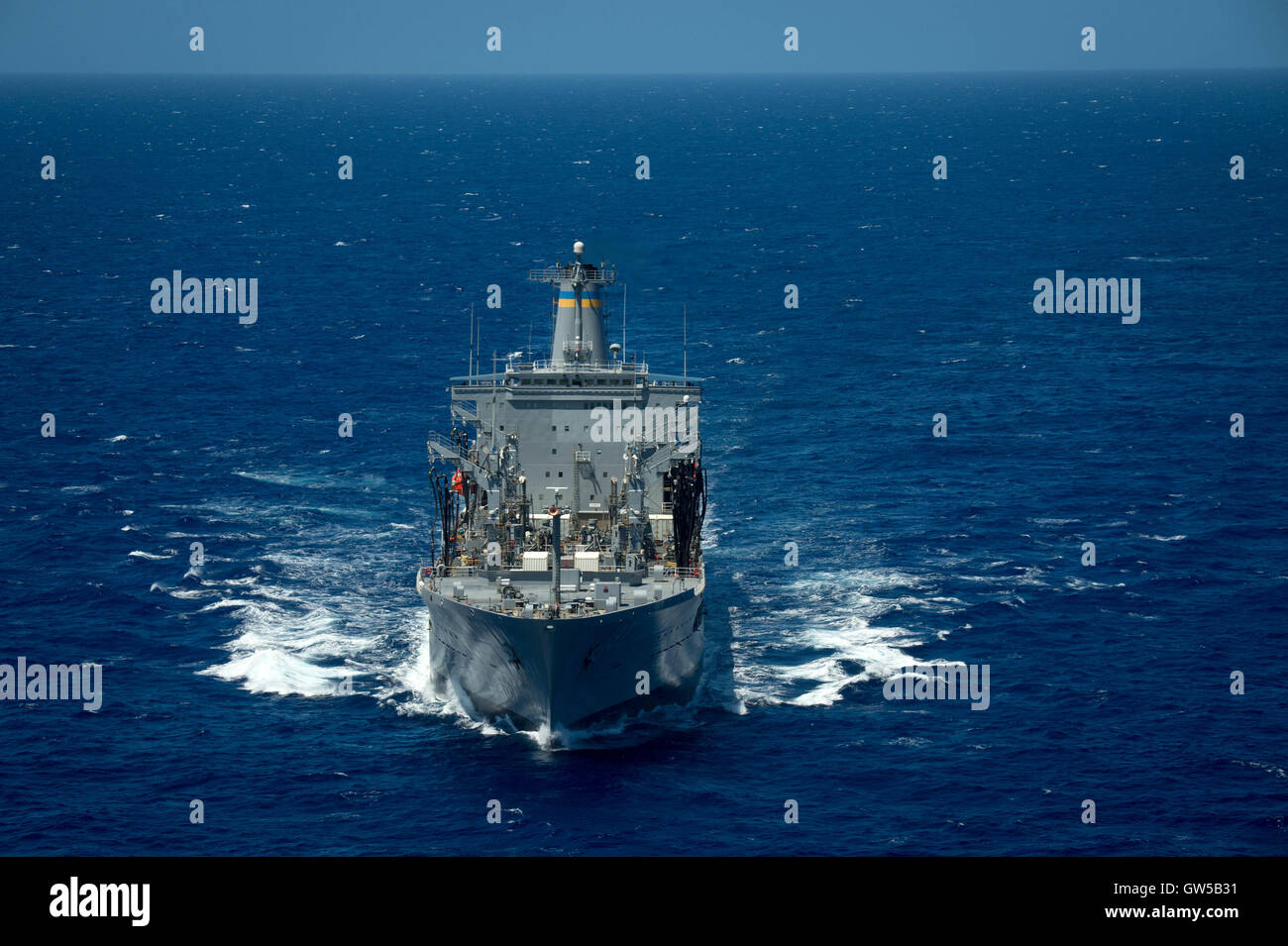 US Navy Military Sealift Command fleet replenishment oiler USNS Henry J. Kaiser steams in close ...