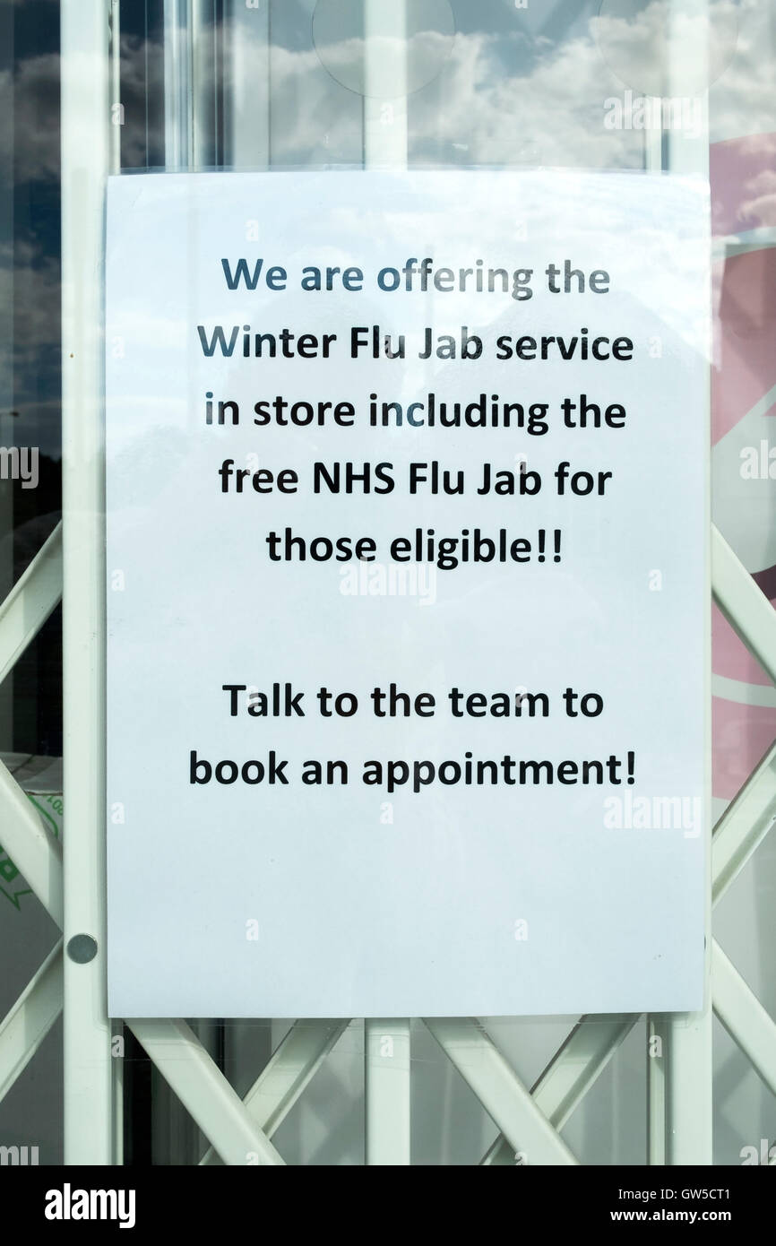 A winter flu jab service sign in a pharmacy window Stock Photo - Alamy