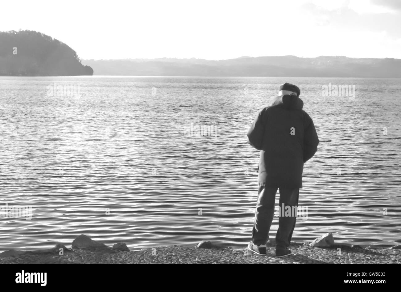 Senior man watching the lake Stock Photo - Alamy