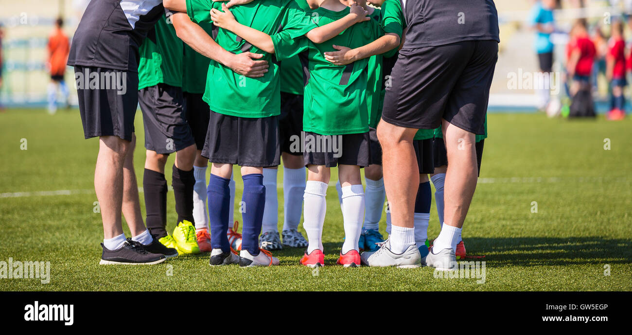 Football soccer match for children. Coach giving young soccer team ...