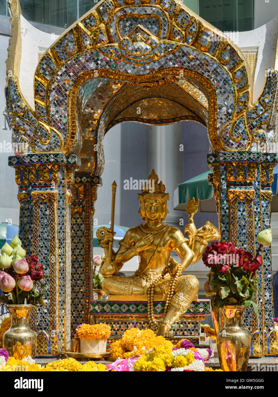 The Phra Phrom gold image at the Erawan Shrine in Bangkok, Thailand ...
