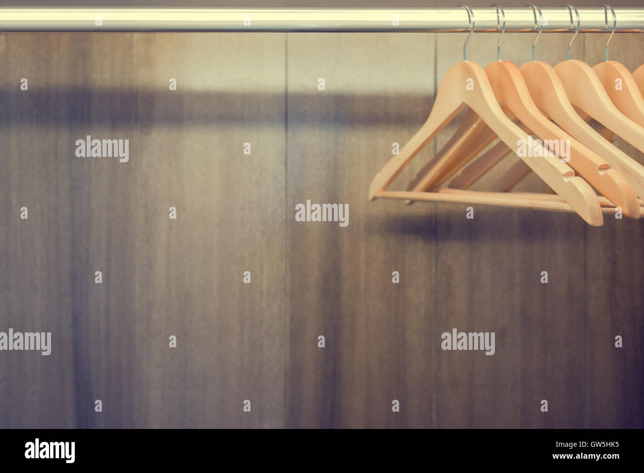 Clothes hanger in wardrobe. Text space available Stock Photo - Alamy