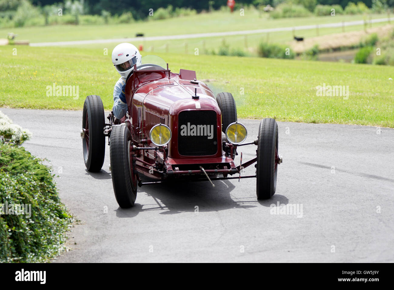 Roland Duce powers his 1926 Maserati T26 into the roundabout at the ...