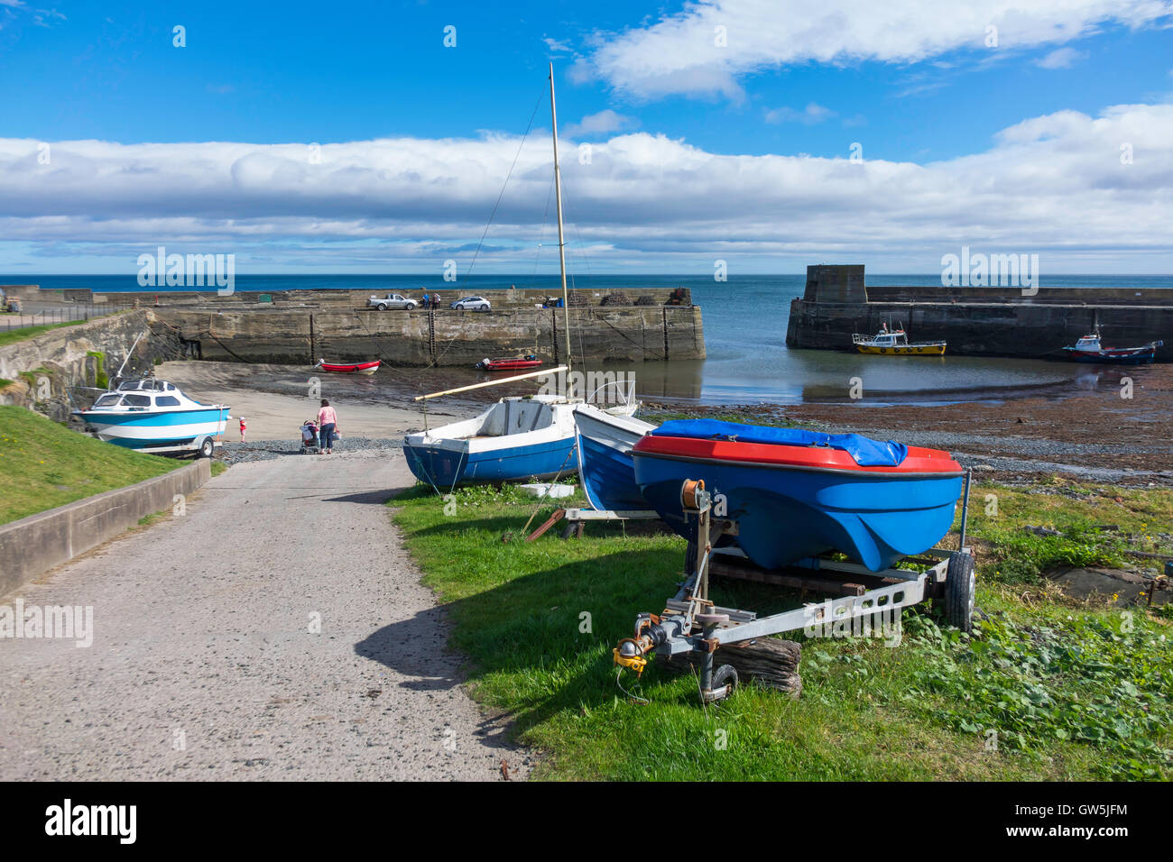The harbour in the picturesque fishing village of Craster ...
