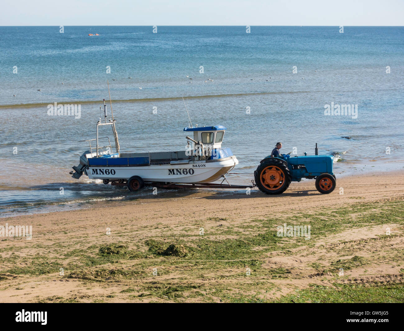 Fishing boat tractor on beach hi-res stock photography and images - Alamy