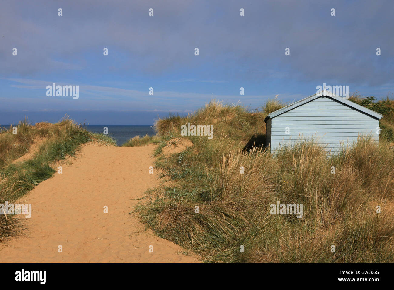 beach hut in sand dunes with sandy path to the sea Stock Photo - Alamy