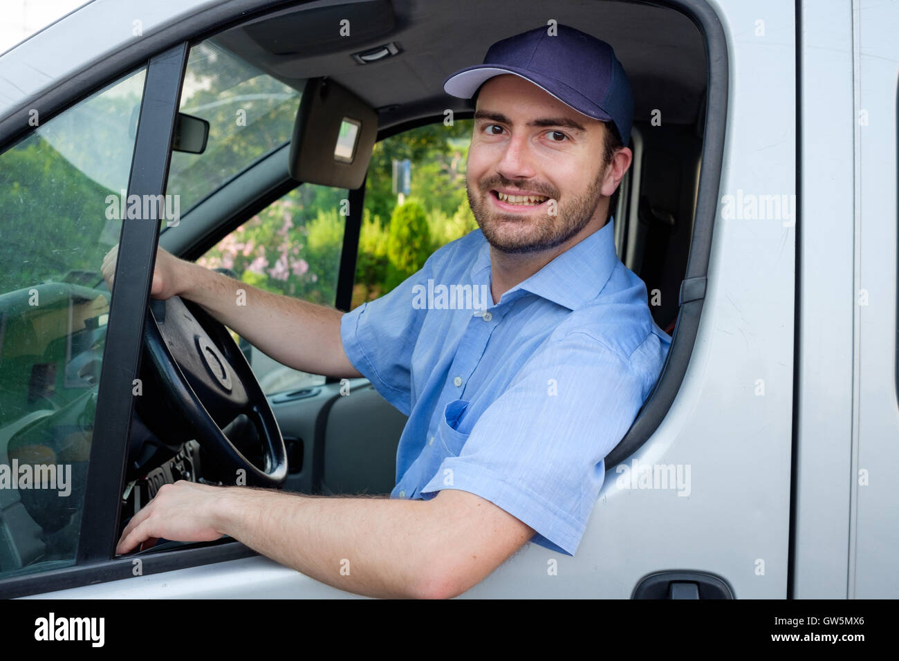 Delivery man driving his van hi-res stock photography and images - Alamy