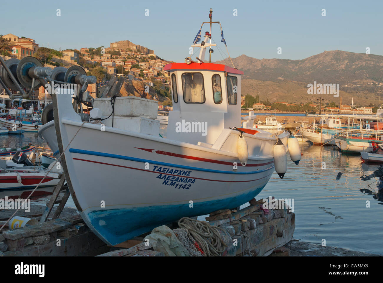 Harbor of a Greek fishing village with fishing boat in dry dock with a ...