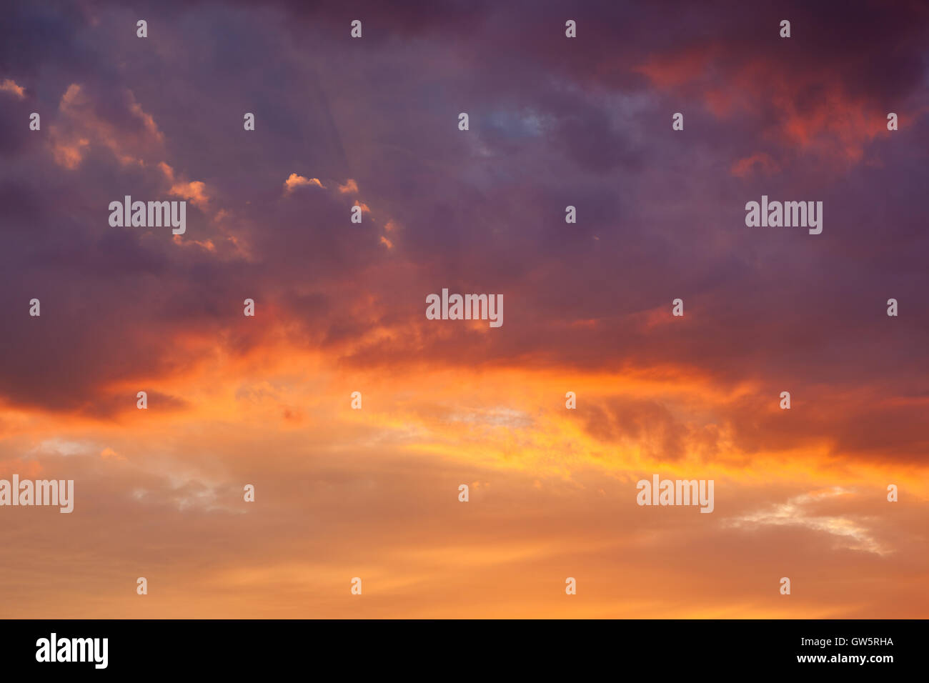 Fiery vivid sunset sky clouds Stock Photo - Alamy