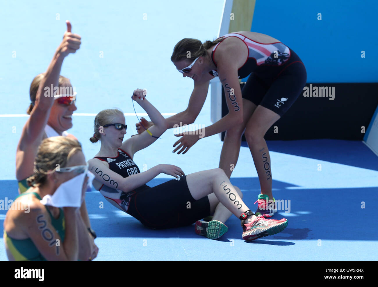 Great Britain's Alison Patrick is helped by her guide after the Women's ...