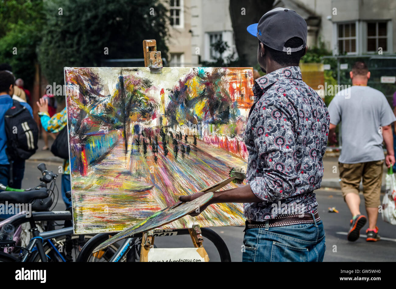 Street artist, painter at Notting Hill Carnival, working on a street ...