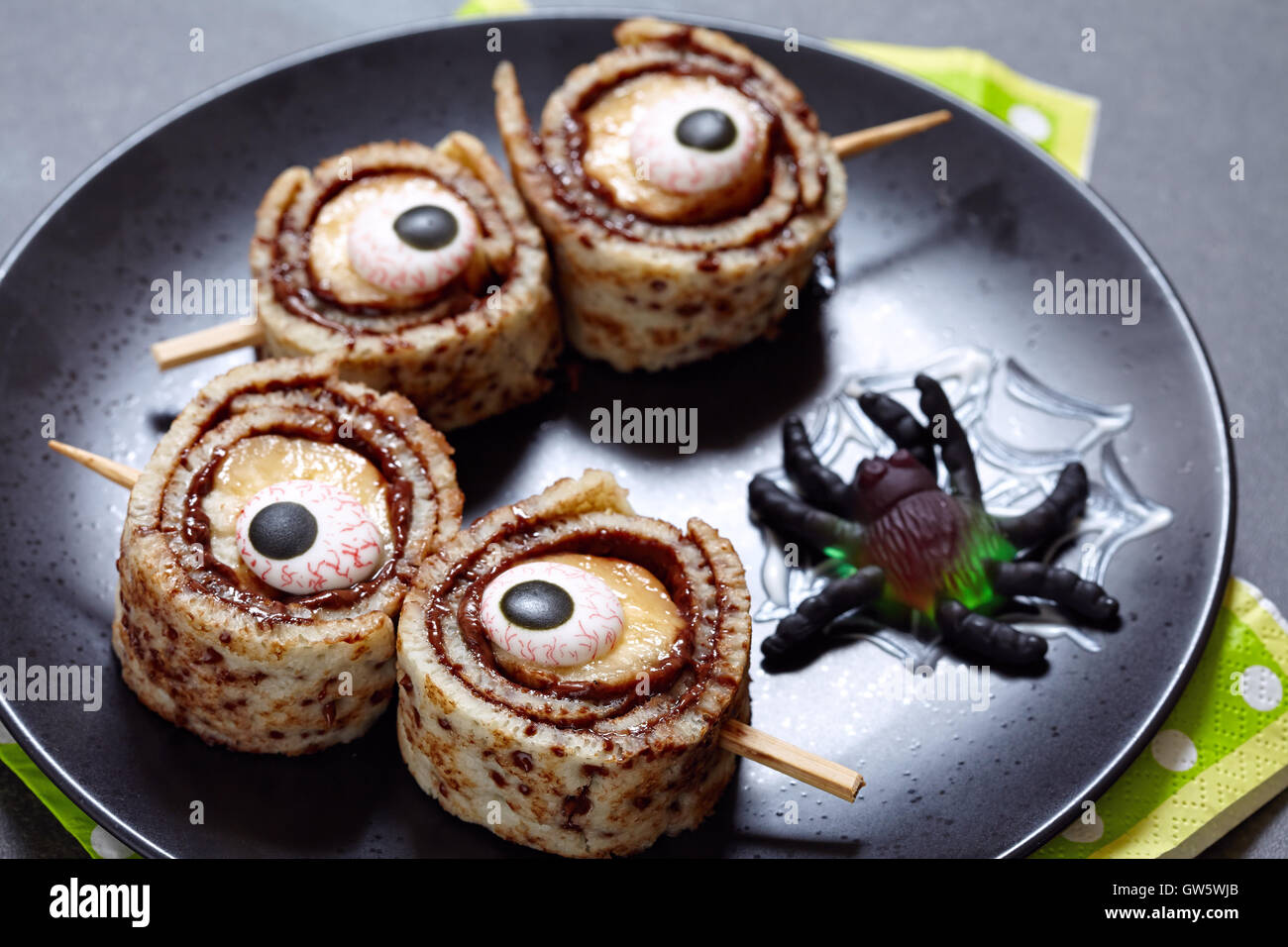 Monster Eyes for Halloween. Crepes roll up with banana Stock Photo - Alamy