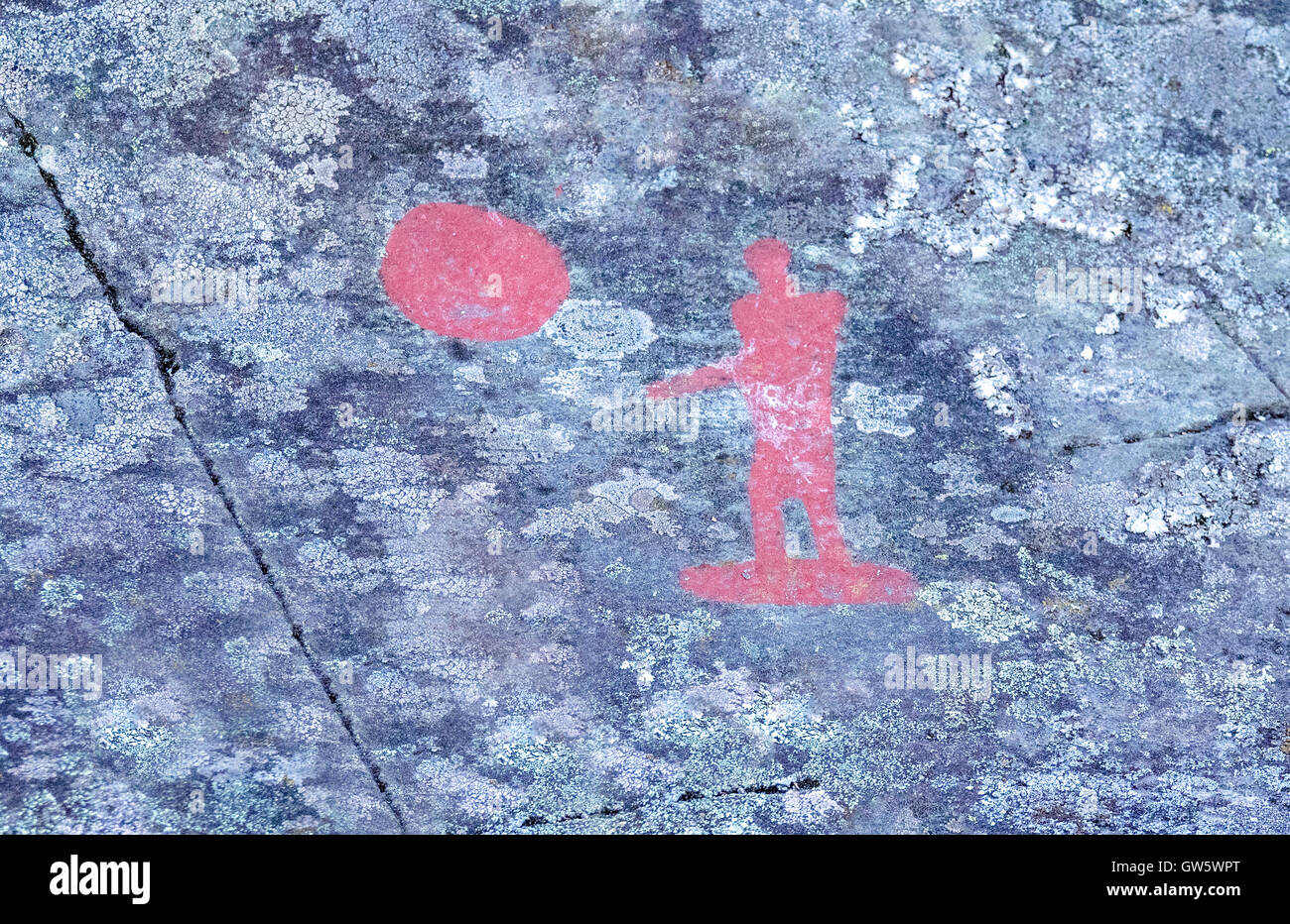Swedish Petroglyphs that looks like a man and the sun Stock Photo - Alamy