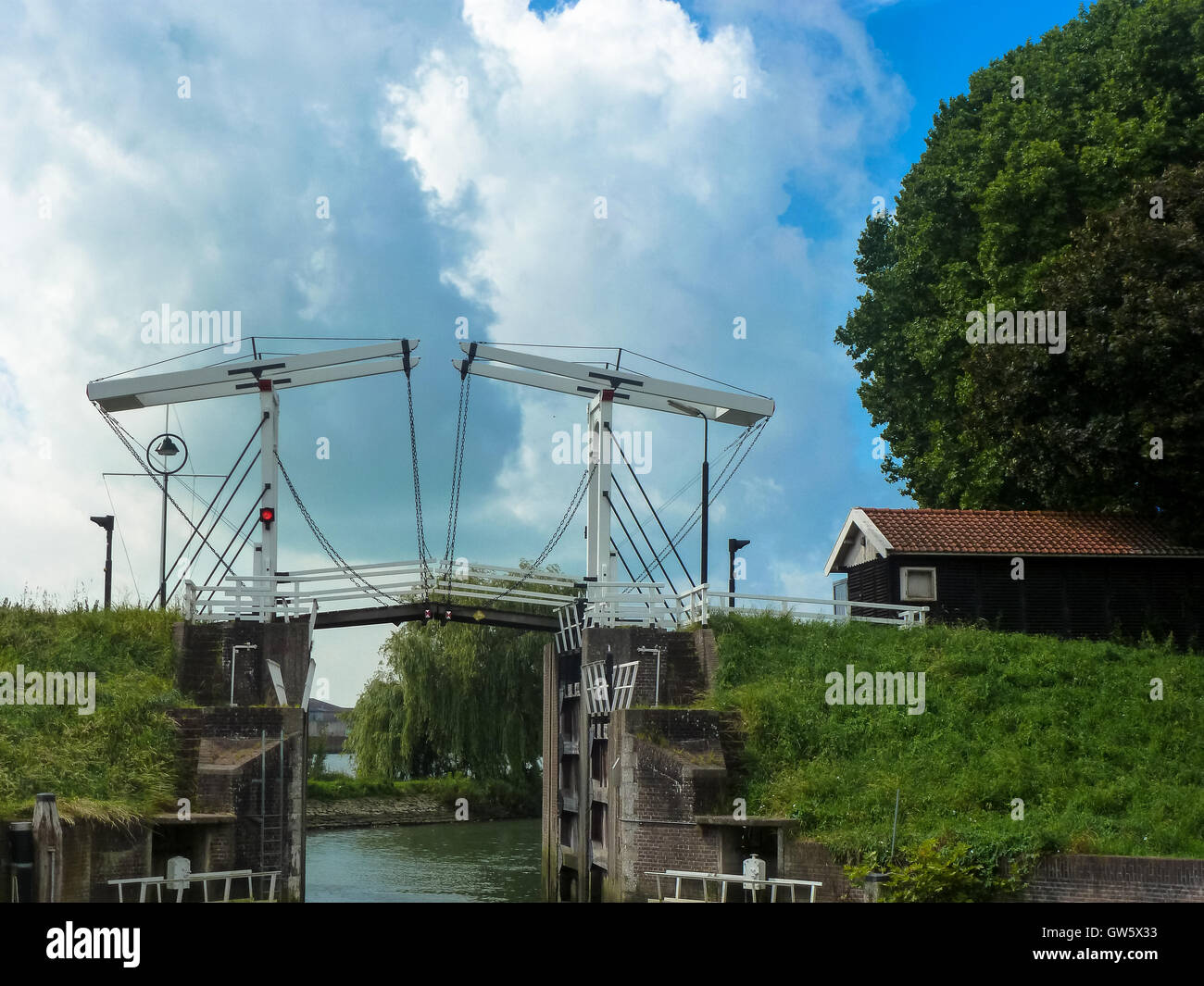 sluice and wooden draw up bridge at schoonhoven holland Stock Photo - Alamy