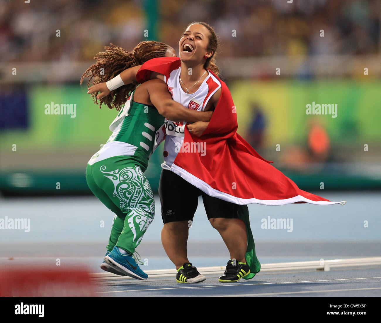 Nigeria's Lauritta Onye (left) celebrates with Tunisia's Rima Abdelli ...