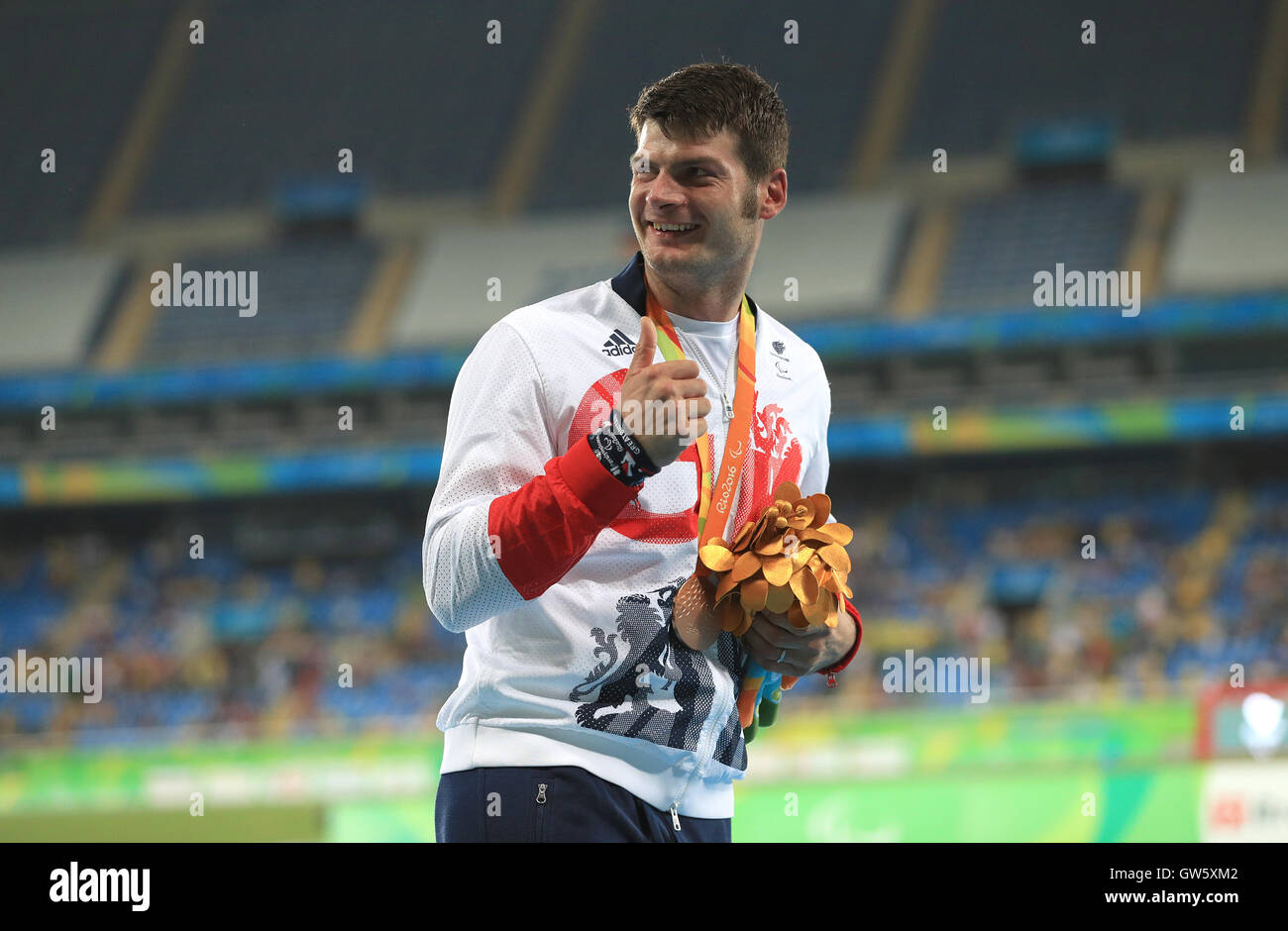 Great Britain's David Henson celebrates on the podium after wining the ...