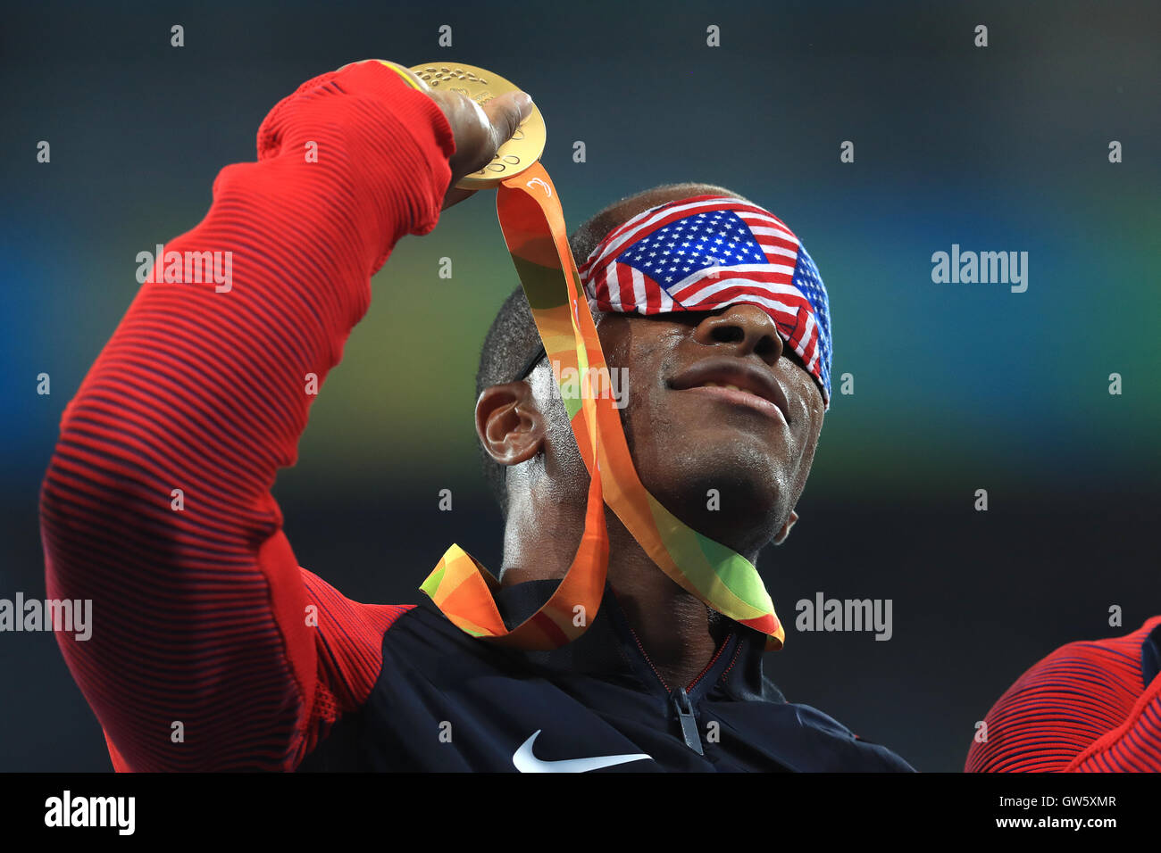 USA's David Brown celebrates on the podium after wining the gold medal ...