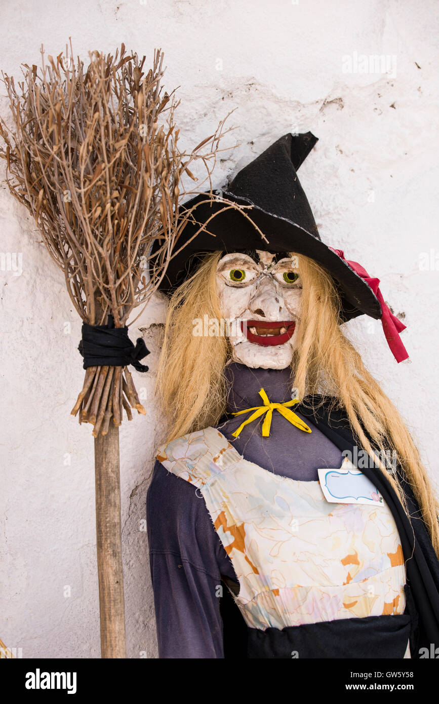 Scarecrow Witch with a whisk on a white wall Stock Photo - Alamy