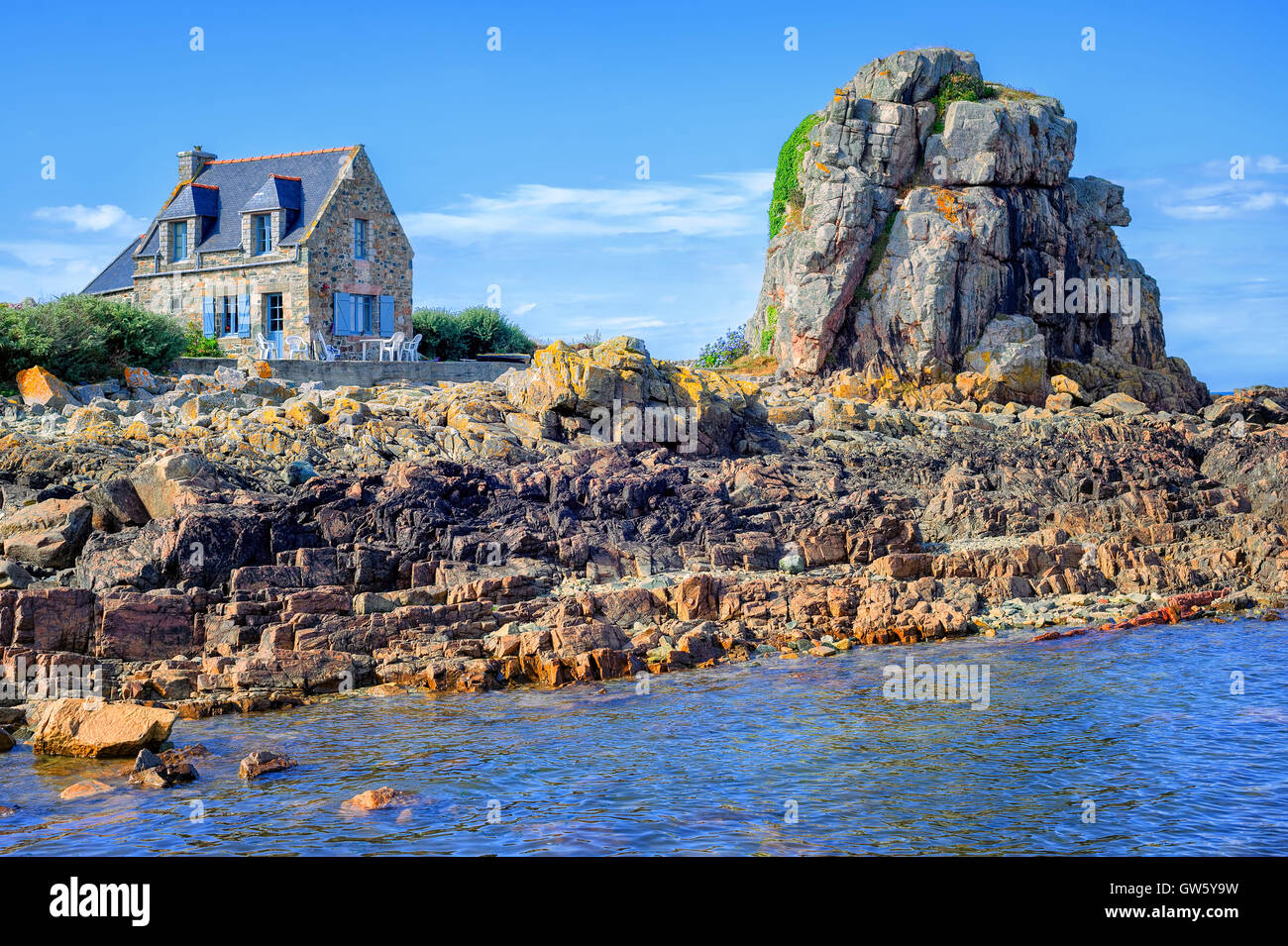 Traditional breton stone house on the rocky atlantic coast of English ...