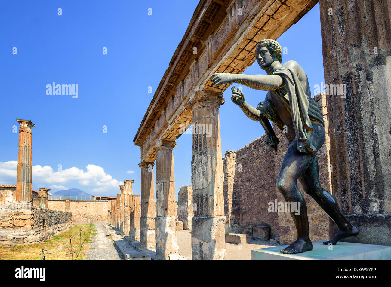 Ruins of the antique Temple of Apollo with bronze Apollo statue in ...