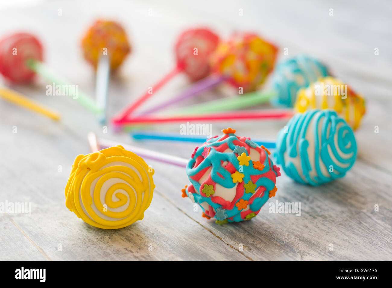 Cake pops with icing Stock Photo - Alamy