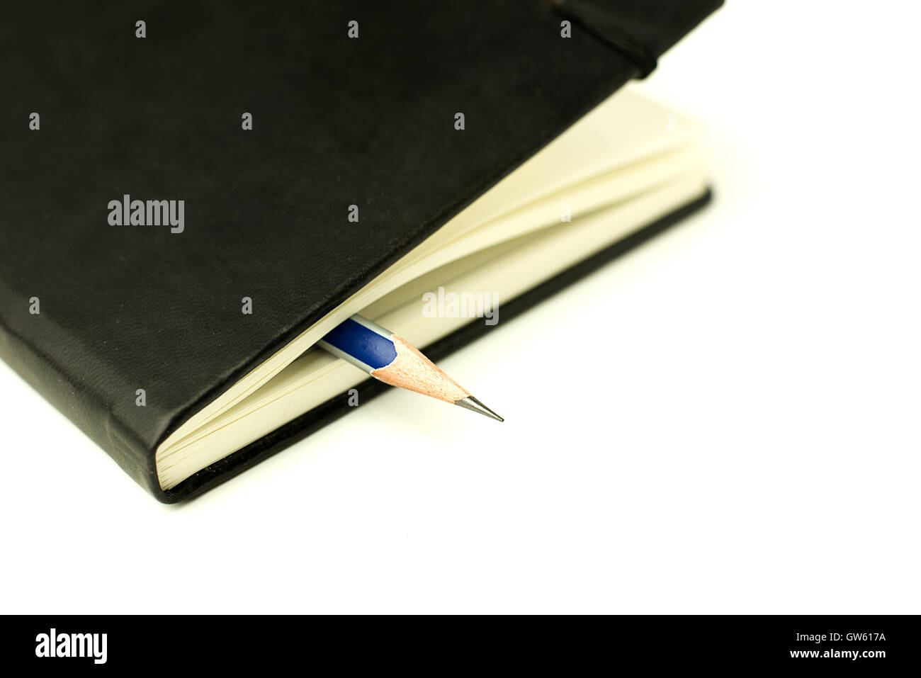 Diary and pencils on white Stock Photo - Alamy