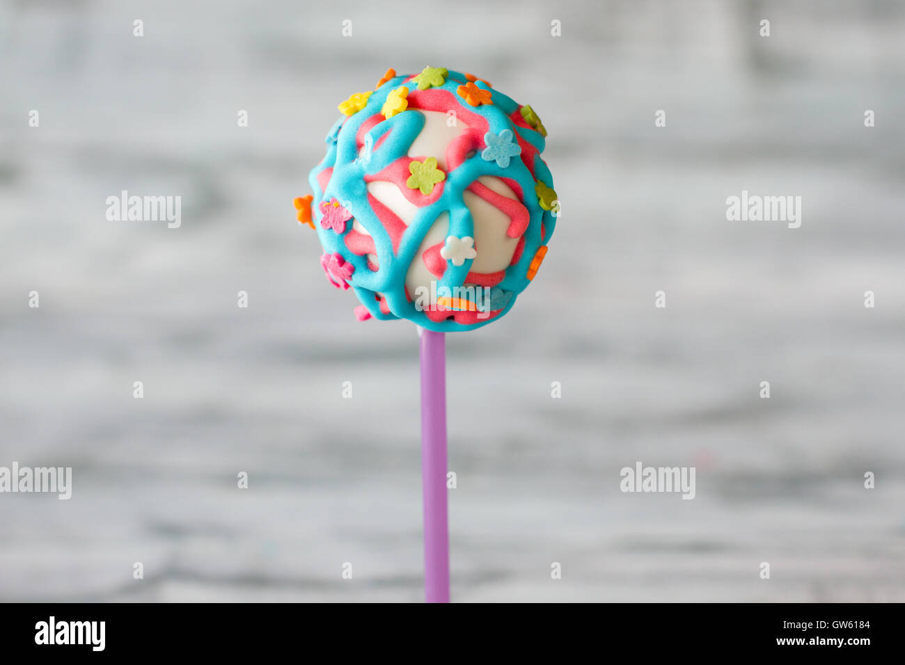 Little cake on stick Stock Photo - Alamy