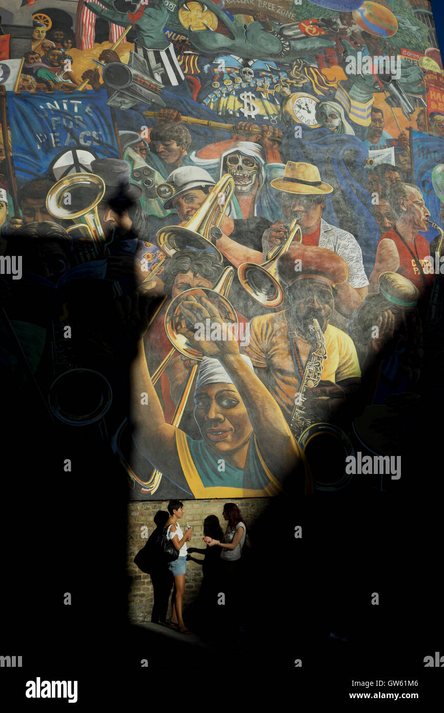 Women talking by Peace mural in Dalston. Hackney, London. UK Stock ...