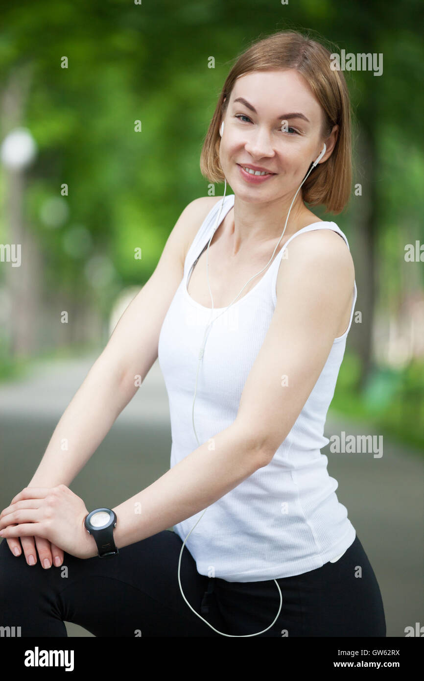 Portrait of happy fitness woman ready to start morning workout Stock ...