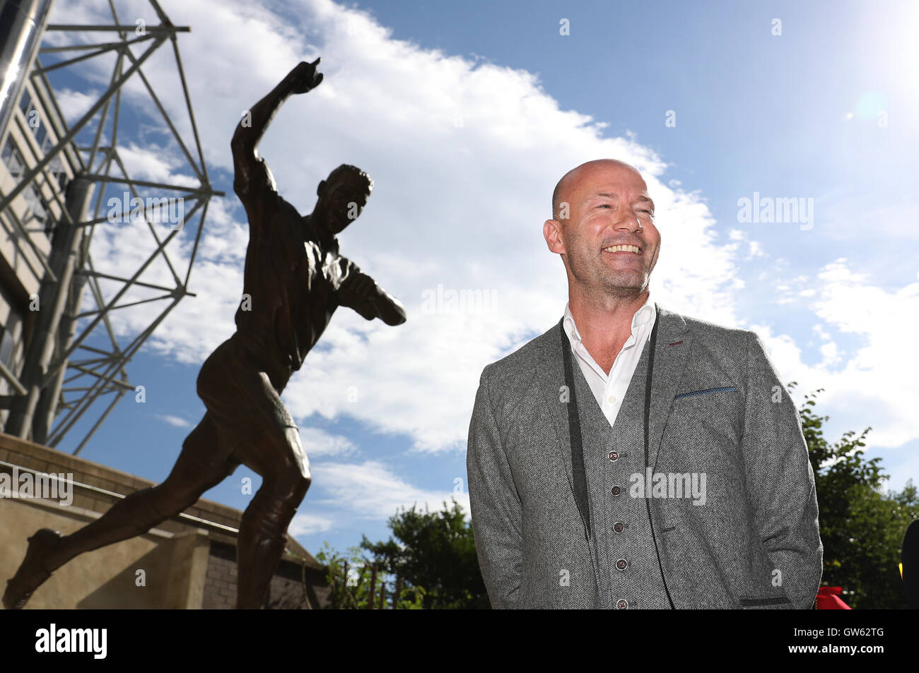 Alan Shearer poses for a photograph next to the newly unveiled statue ...