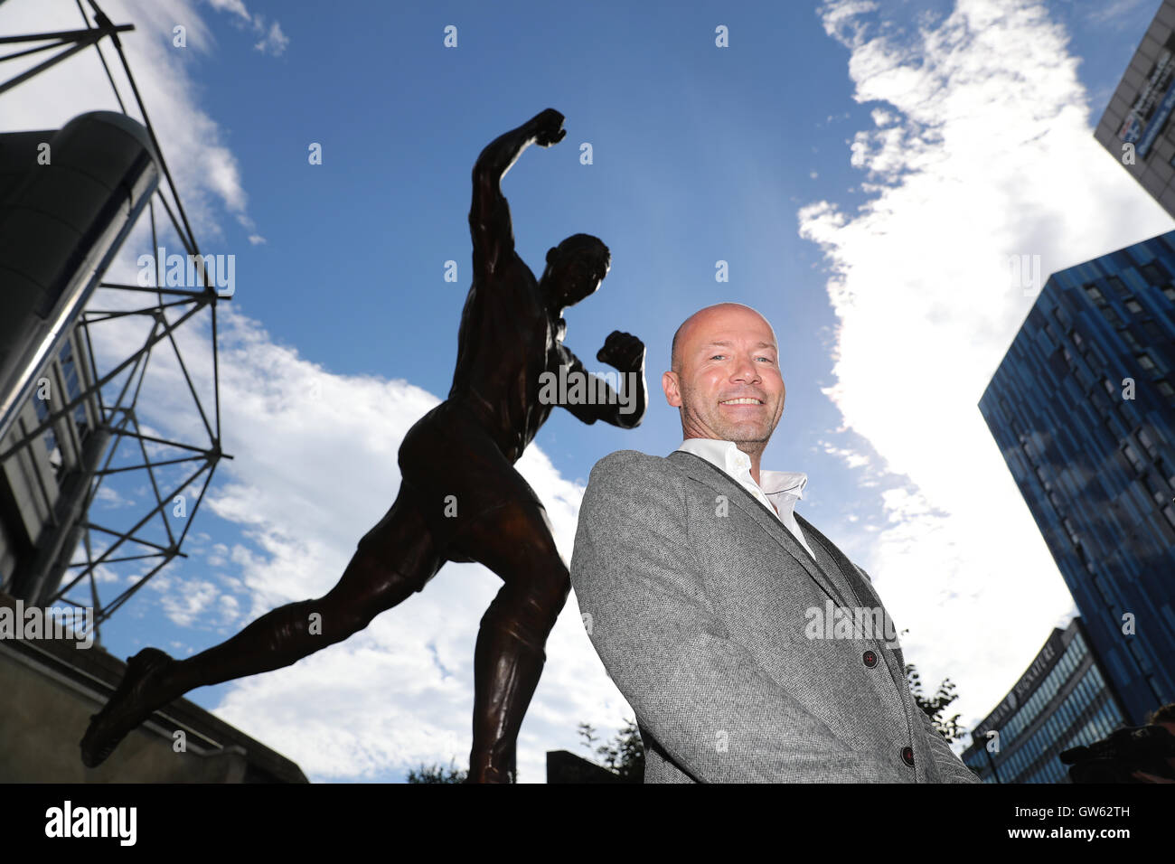 Alan Shearer poses for a photograph next to the newly unveiled statue ...