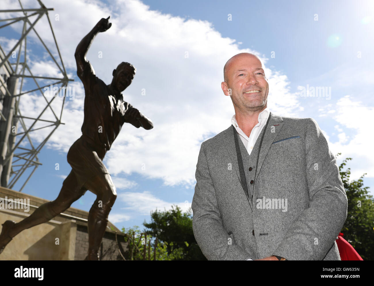 Alan Shearer poses for a photograph next to the newly unveiled statue ...