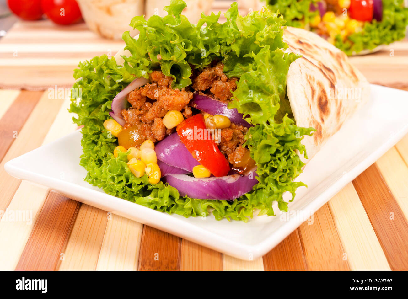 Burrito on plate Stock Photo - Alamy