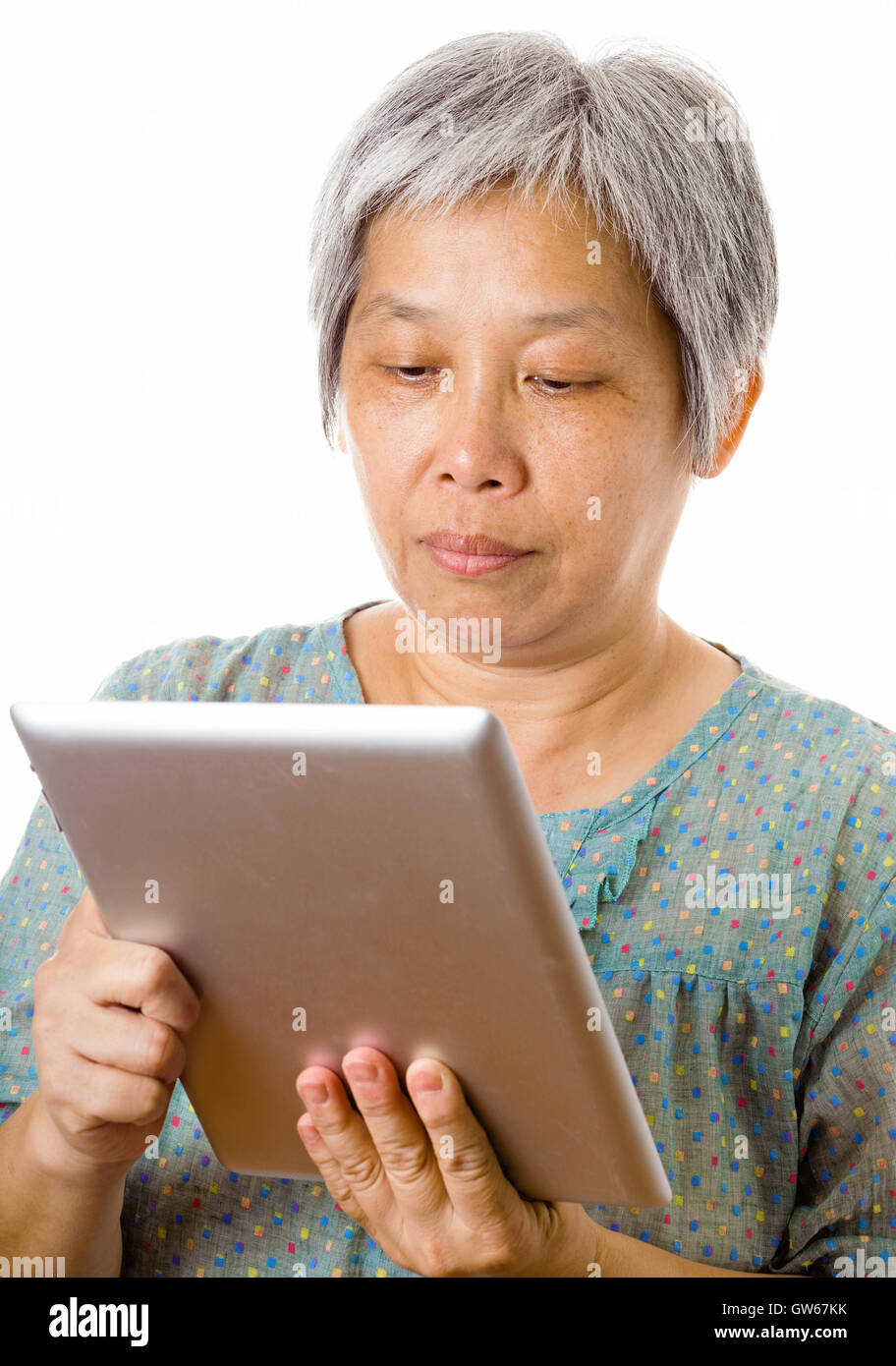 Asian elderly using tablet Stock Photo - Alamy