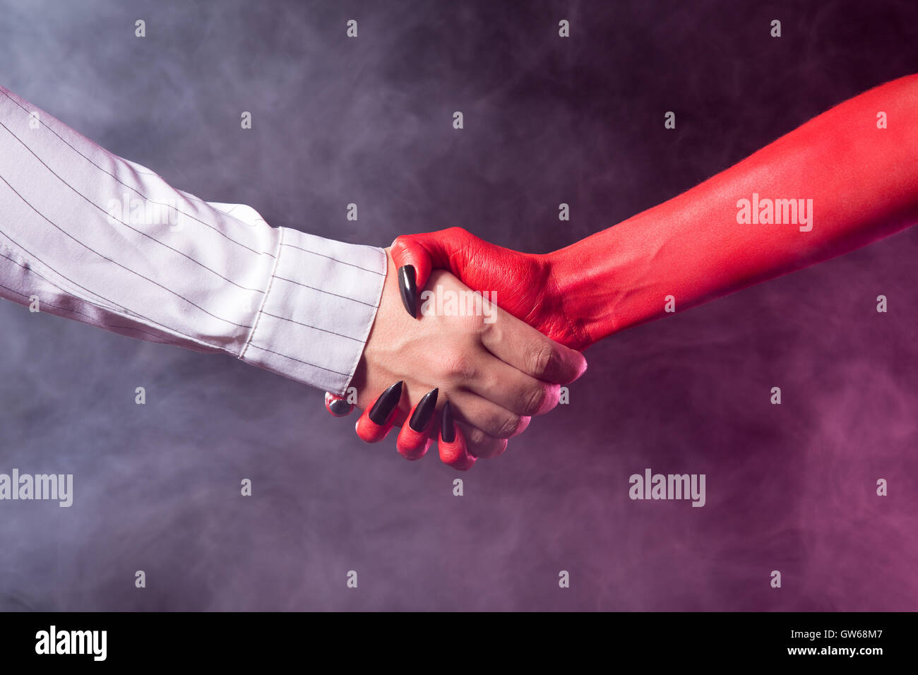 Shake hands with the devil hi-res stock photography and images - Alamy