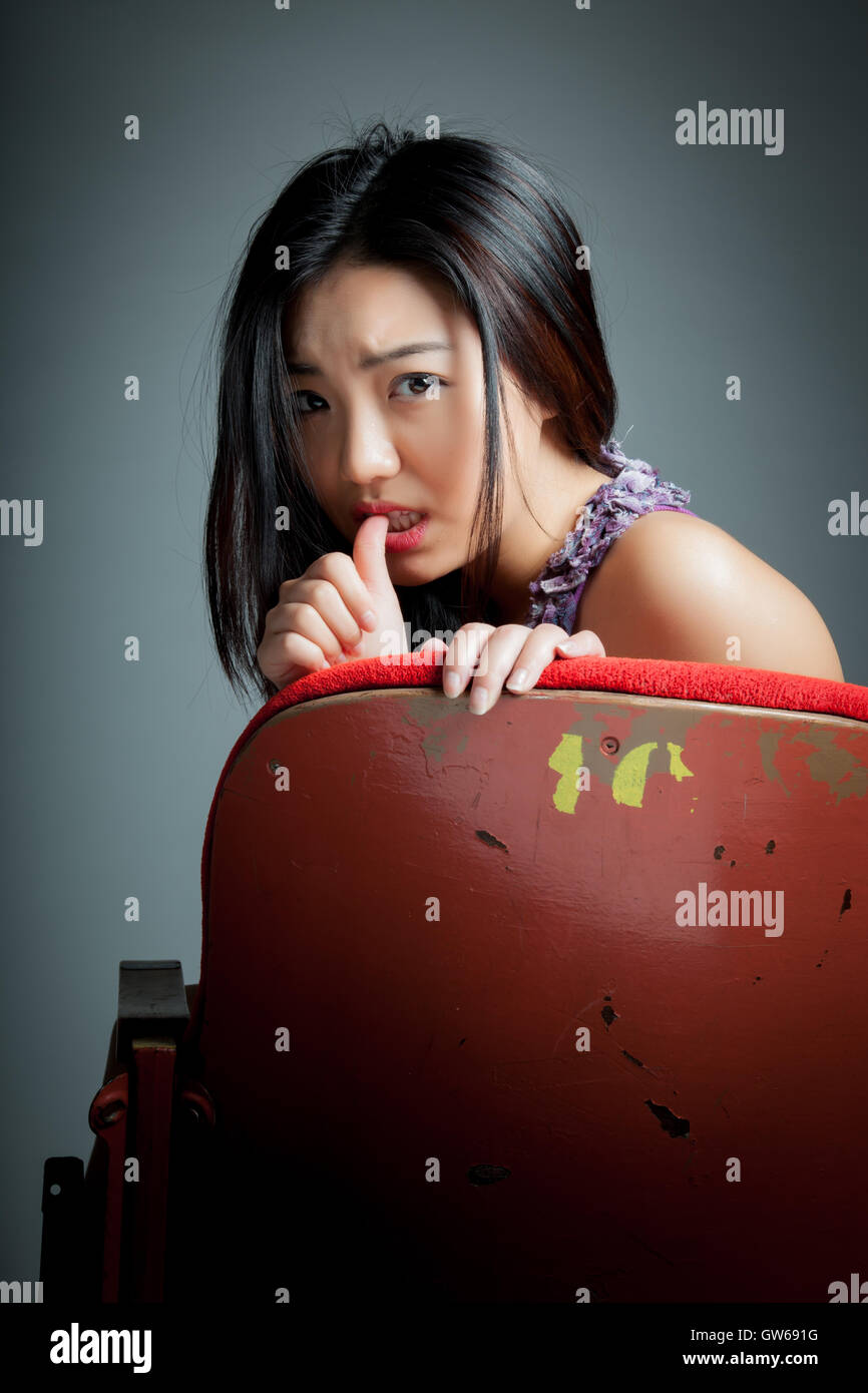 Scared girl looking back hi-res stock photography and images - Alamy