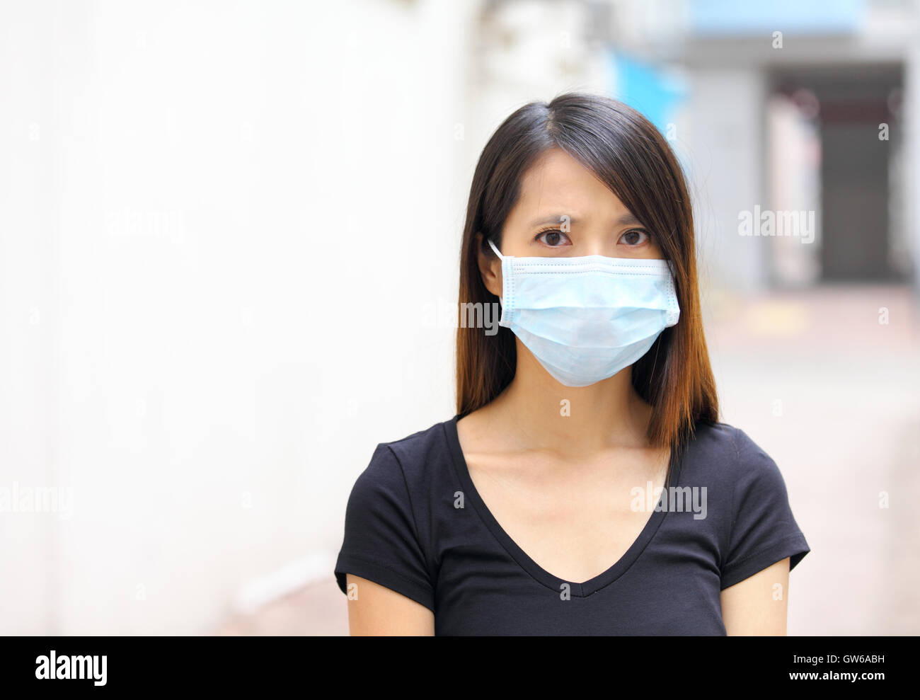 Asian woman with face mask Stock Photo - Alamy