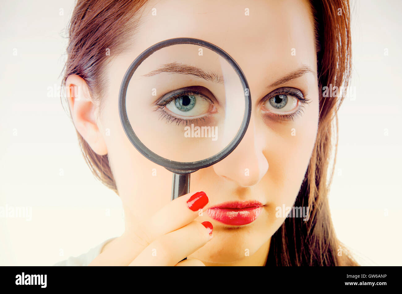 Women with magnifying glass Stock Photo - Alamy
