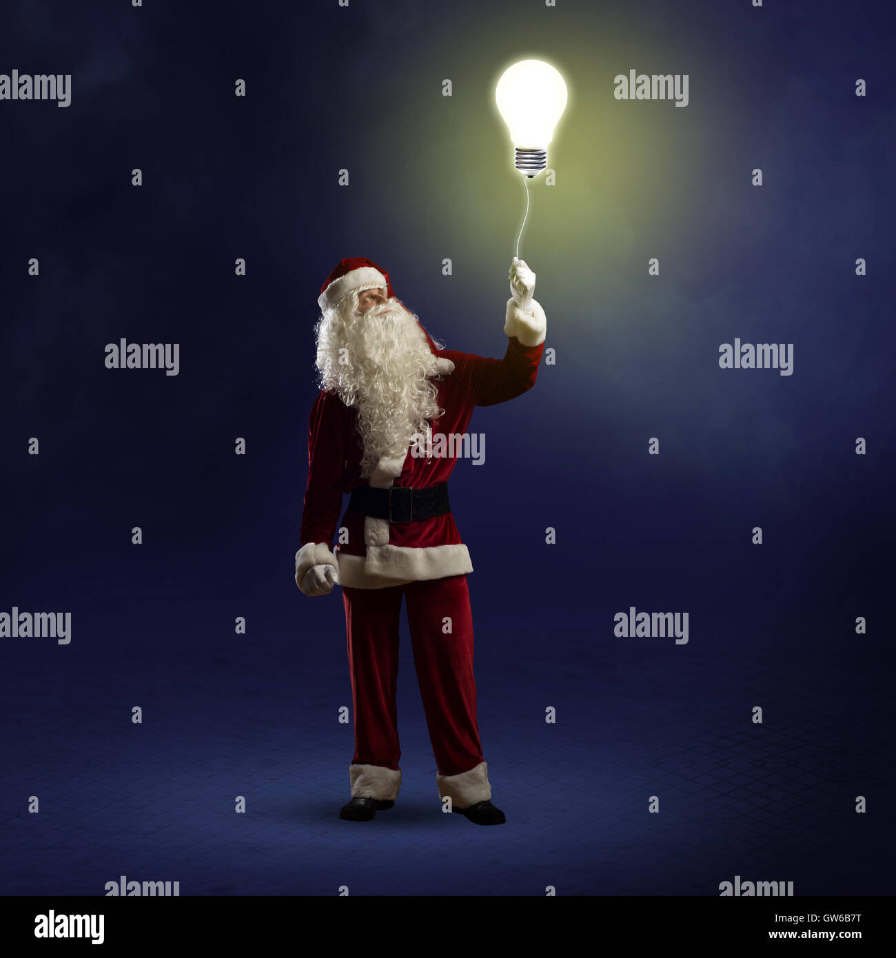 Santa claus holding shining lamp hi-res stock photography and images ...